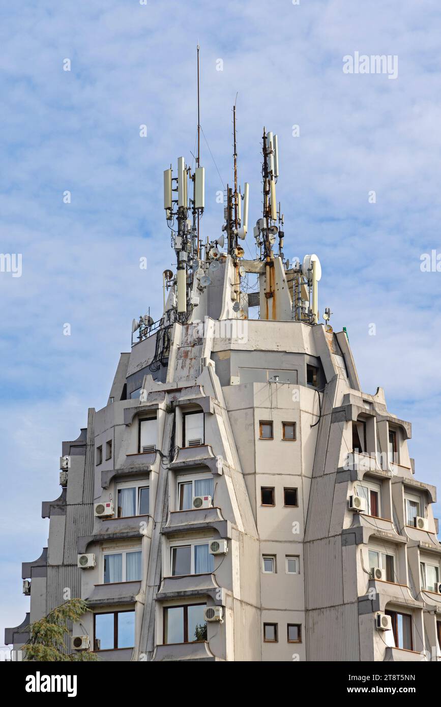 Communication Antennas Mix at Top of Concrete Hotel Building in City ...