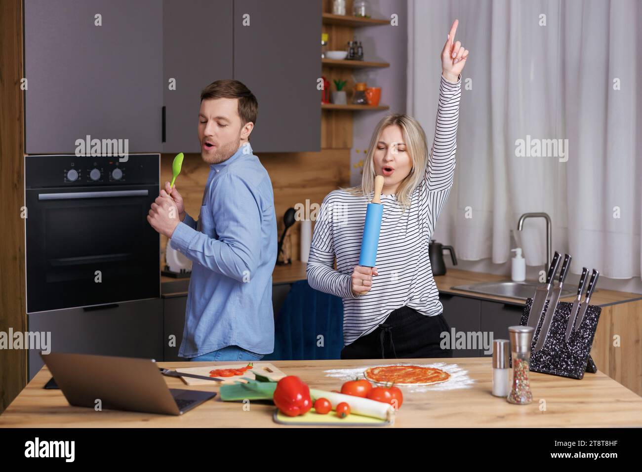 Couple dancing in kitchen using hi-res stock photography and images - Alamy