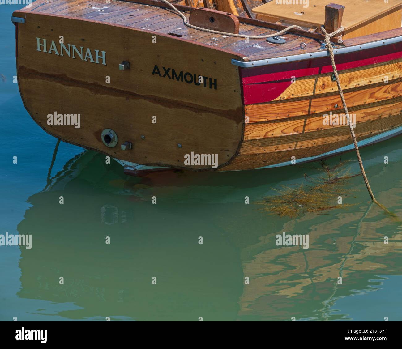 A wooden pleasure craft moored in The Cobb at Lyme Regis, Dorset ...