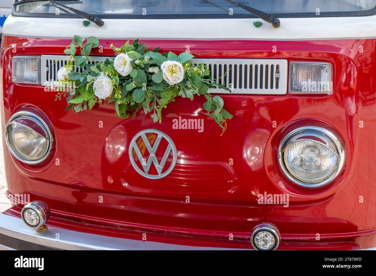 Newlyweds car. Red minibus volkswagen. Retro bus car. Decorated with ...