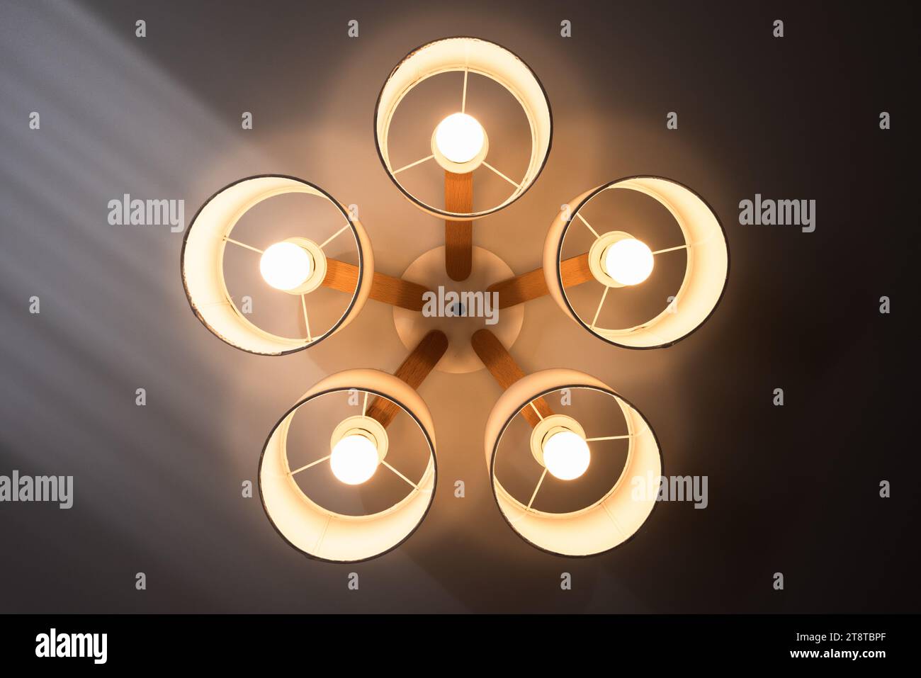 Modern chandelier with five round lampshades, bottom view Stock Photo ...