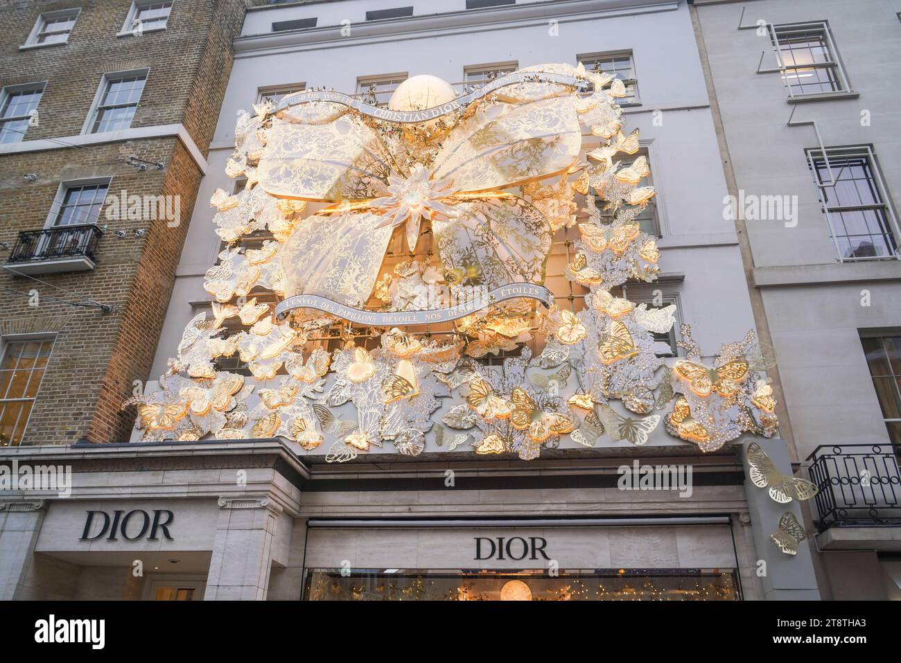 London, UK. 21 November 2023. A large butterfly adorns the facade of ...