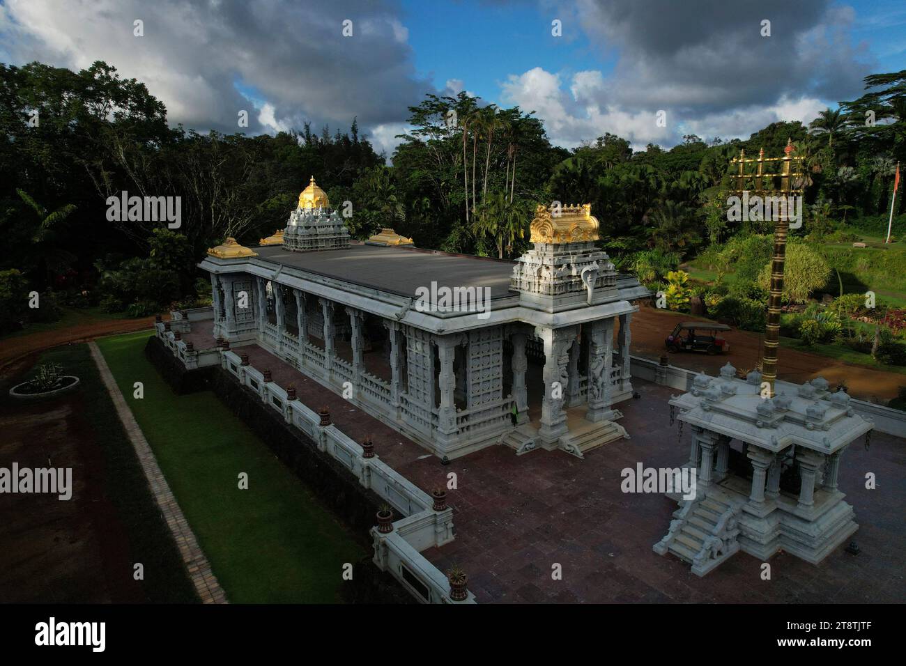 The sun shines down on the golden spires of the Iraivan Temple at Kauai ...
