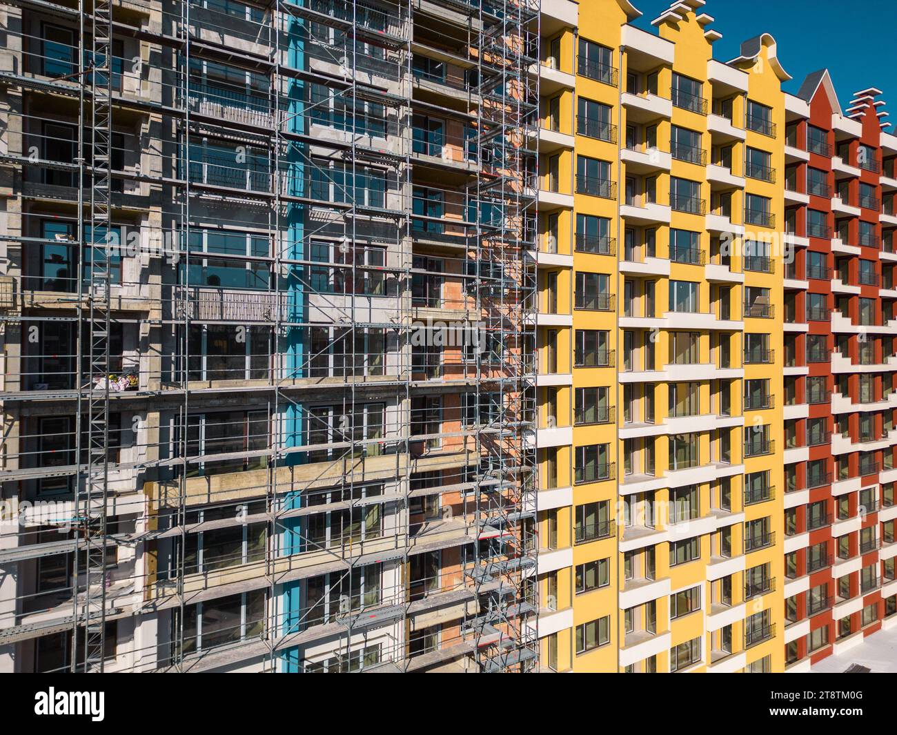 Drone flight along the facade of a modern apartment building under ...