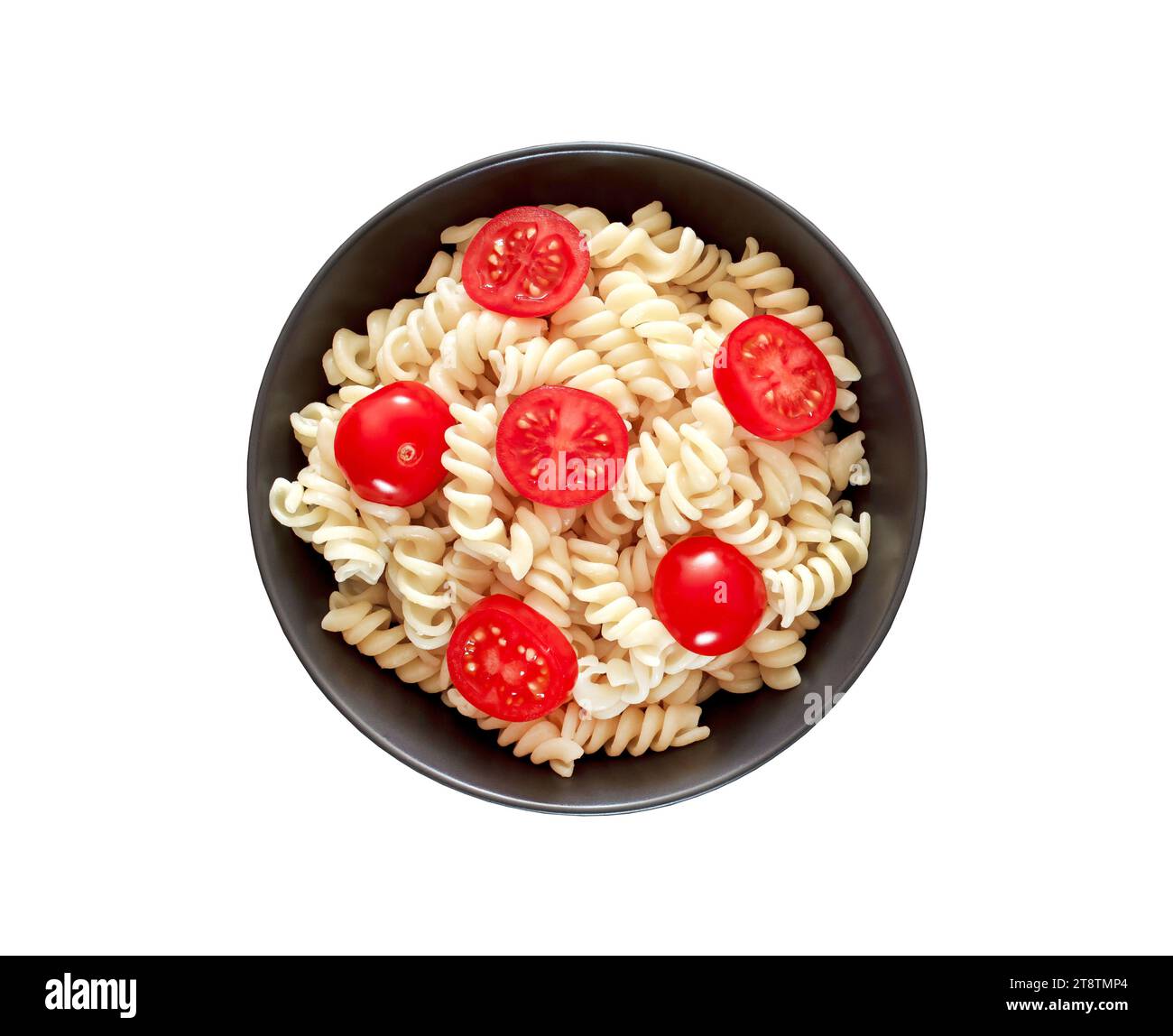 Fusilli pasta cooked with tomatoes, in bowl, isolated on white ...