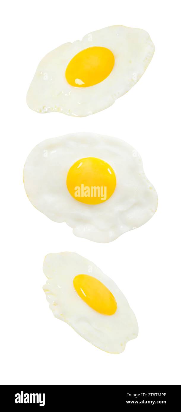 Fried eggs, three pieces, falling, hanging, flying, soaring, isolated ...