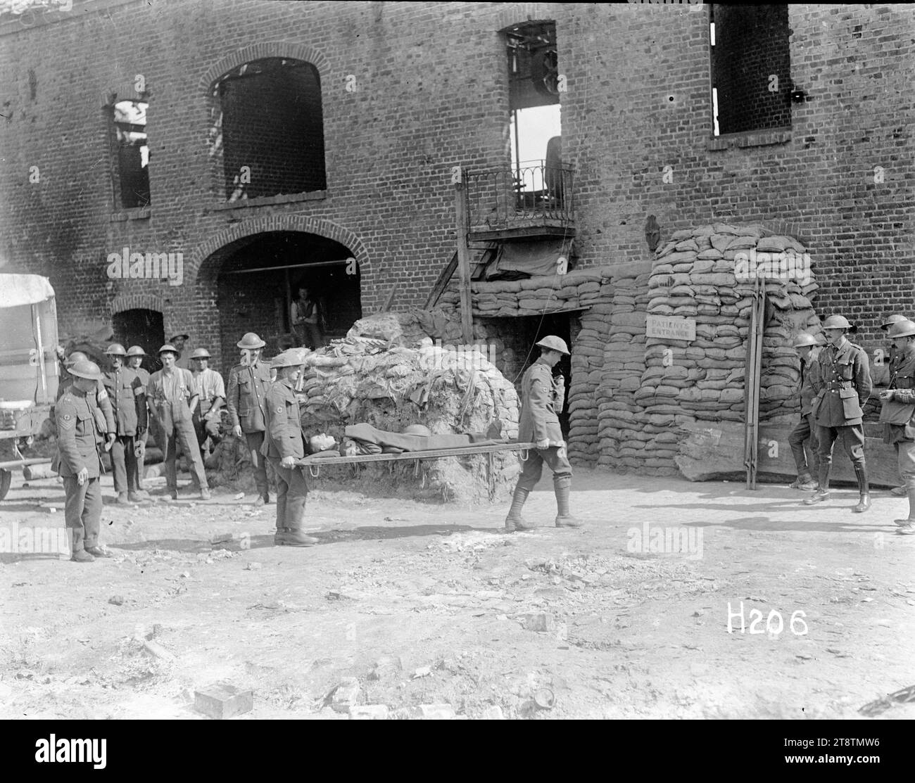A regimental aid post at Warneton, World War I, Stretcher bearers carry ...