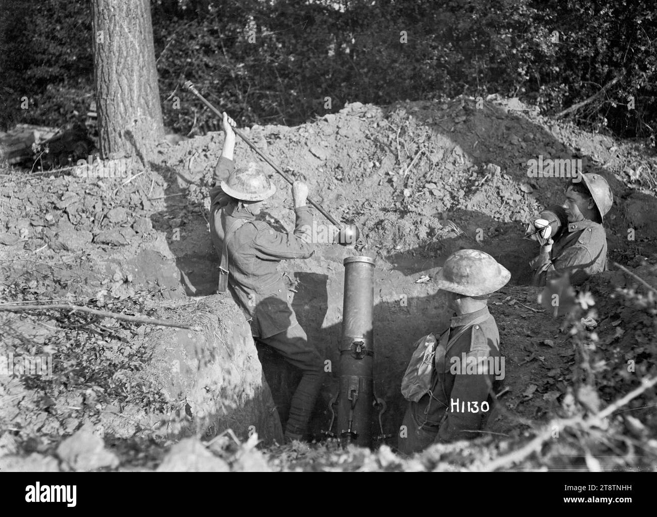 Three New Zealand soldiers using a trench mortar in Le Quesnoy, France ...