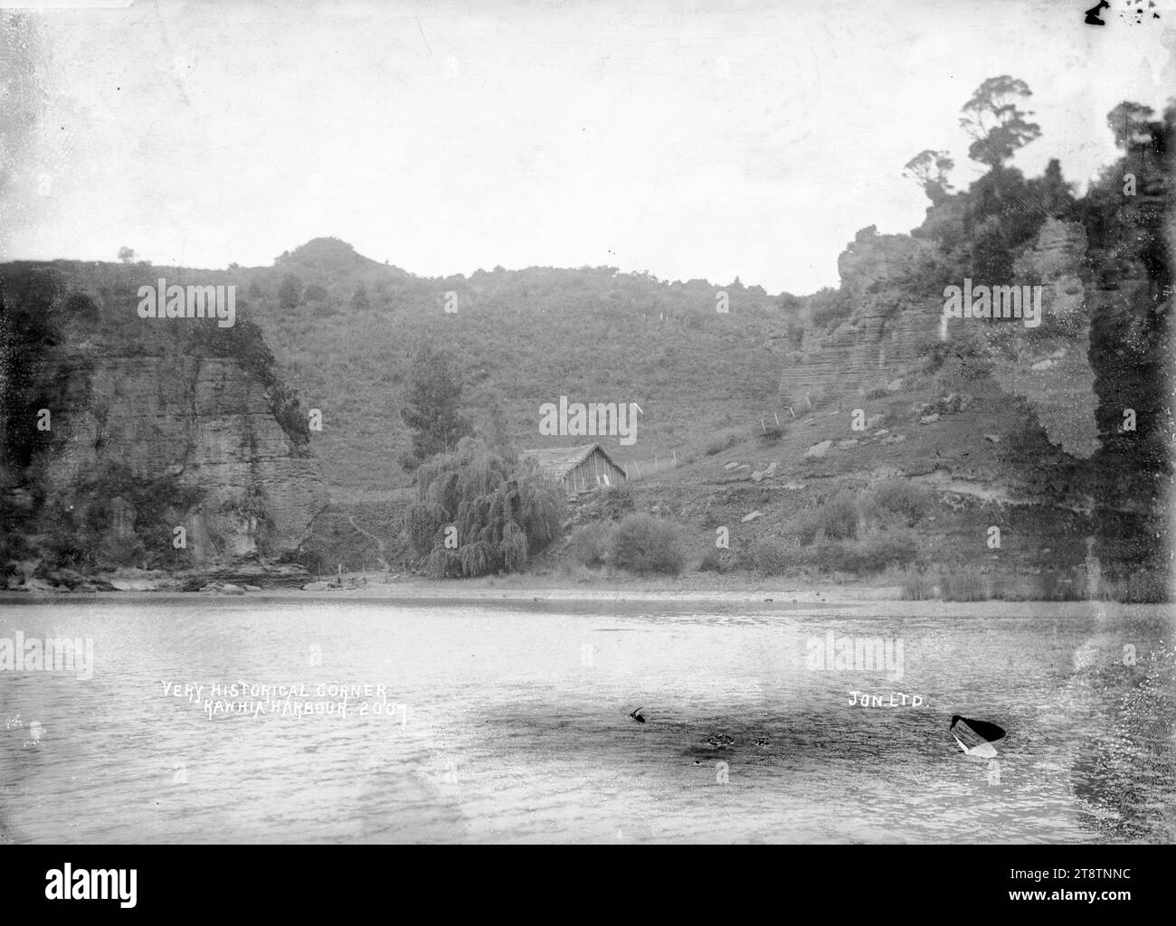 Kawhia Harbour, View of Kawhia Harbour, showing two whare. Photograph ...