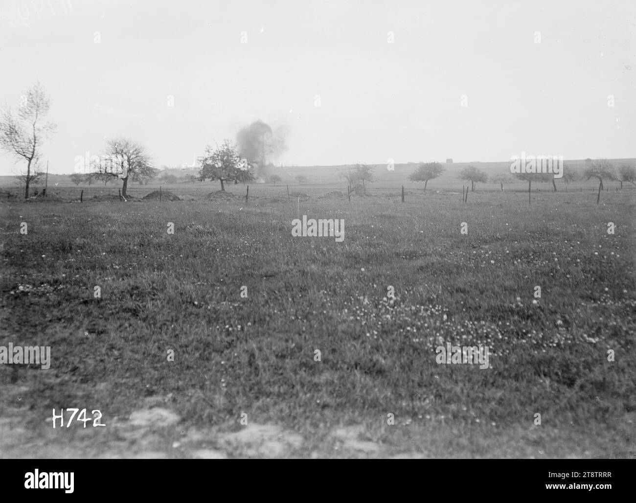 German shelling of a French orchard, World War I, An explosion is seen ...