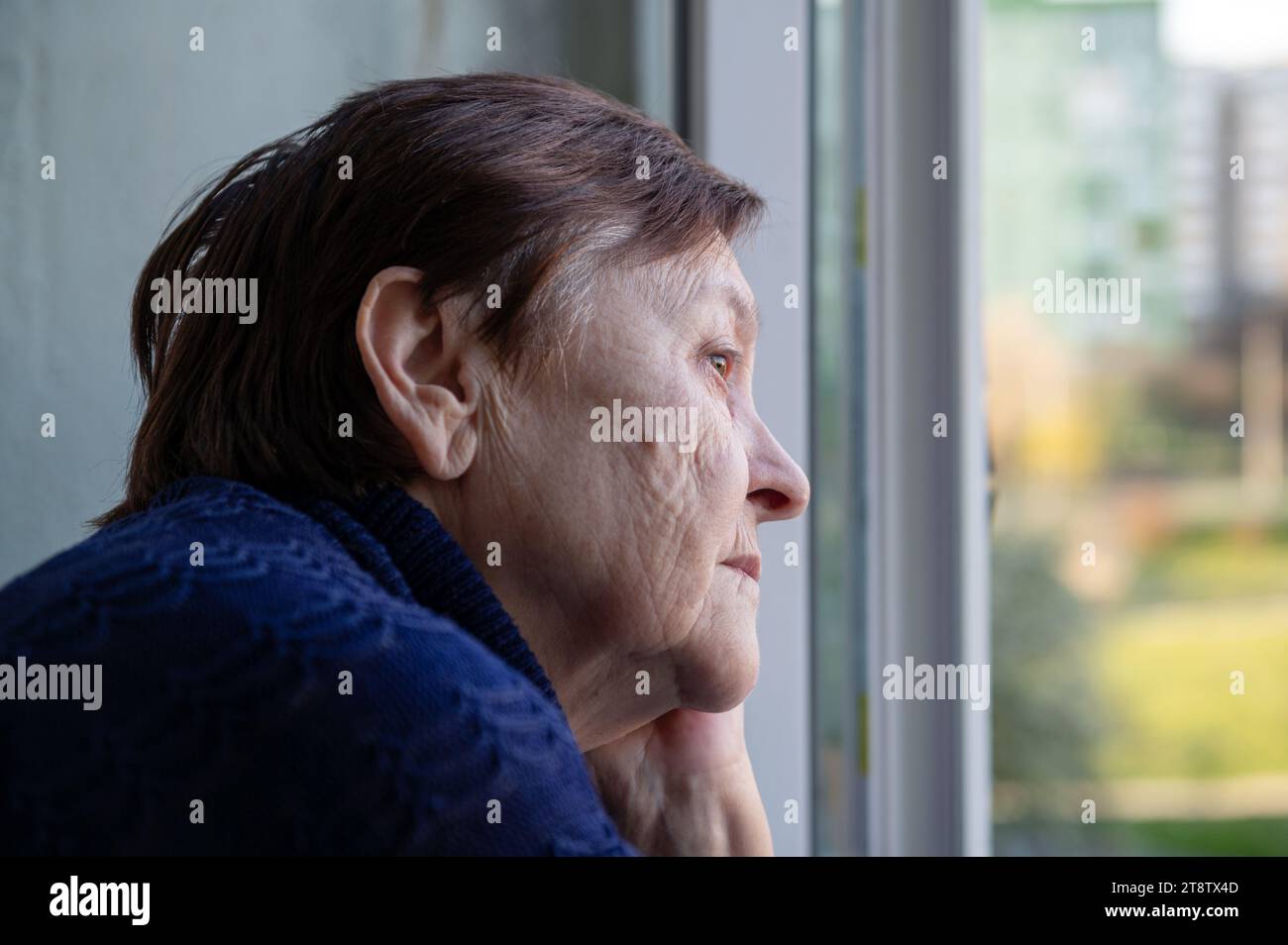 Grandma looking out window hi-res stock photography and images - Alamy