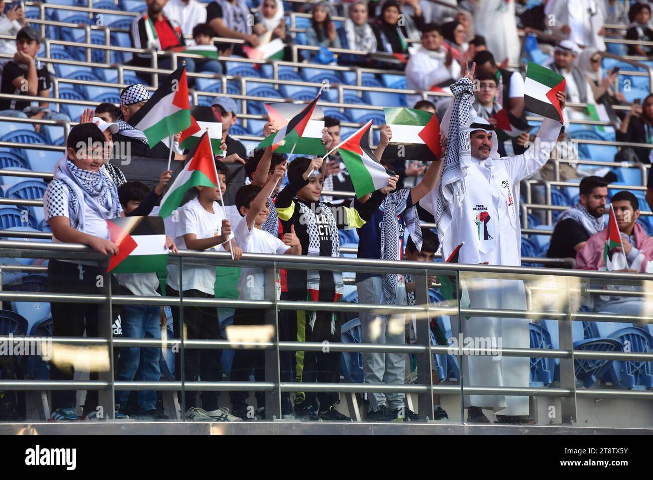 Palestinian fans wave Palestine national flags ahead of a qualifying ...