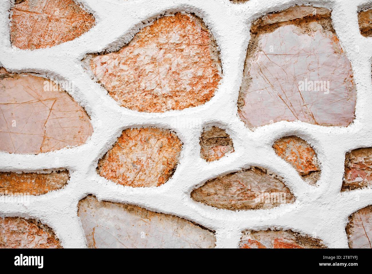 Wall from red and grey stones background, texture irregular shapes ...