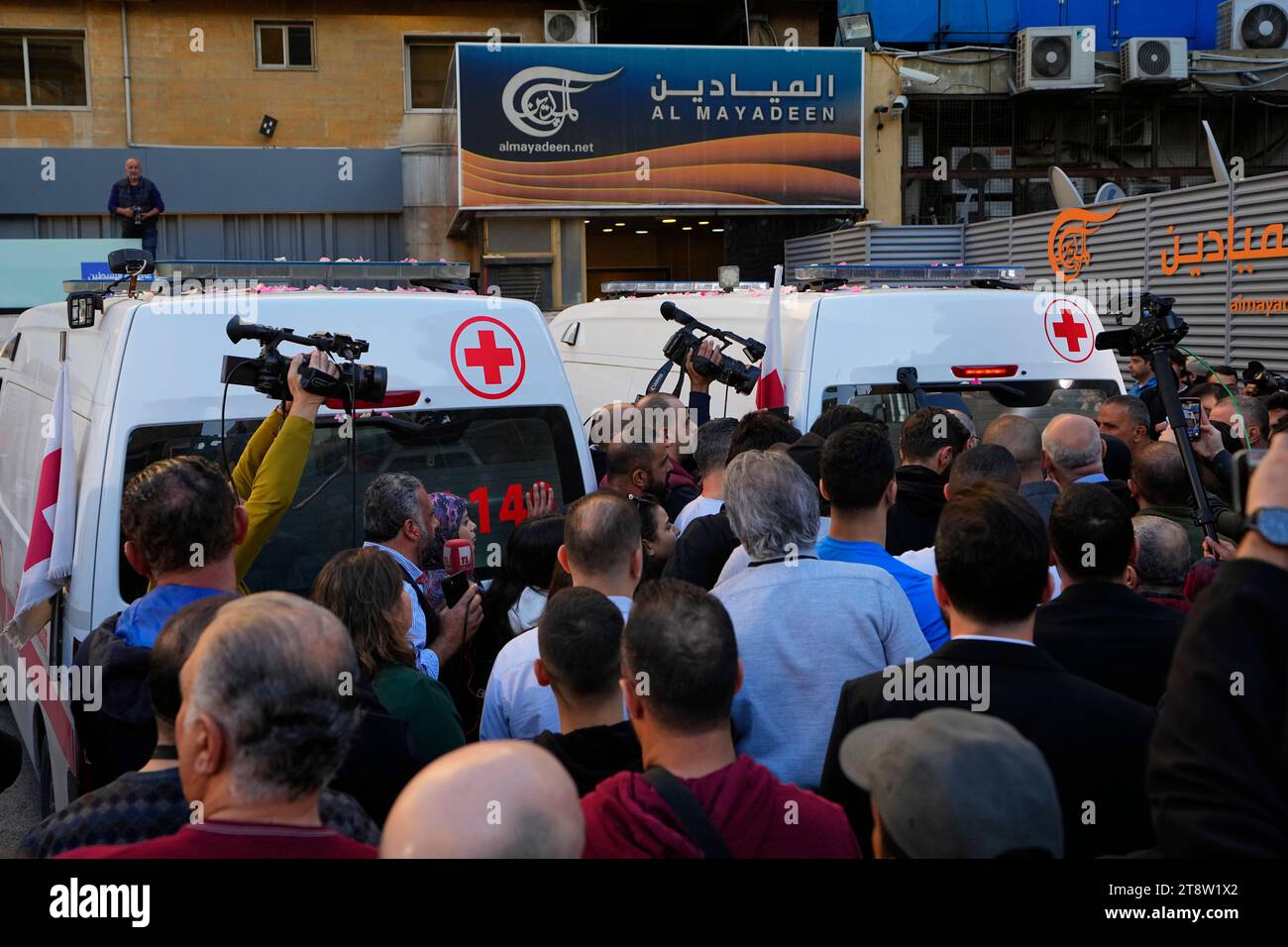 Journalists and family members gather next to Lebanese Red Cross ...