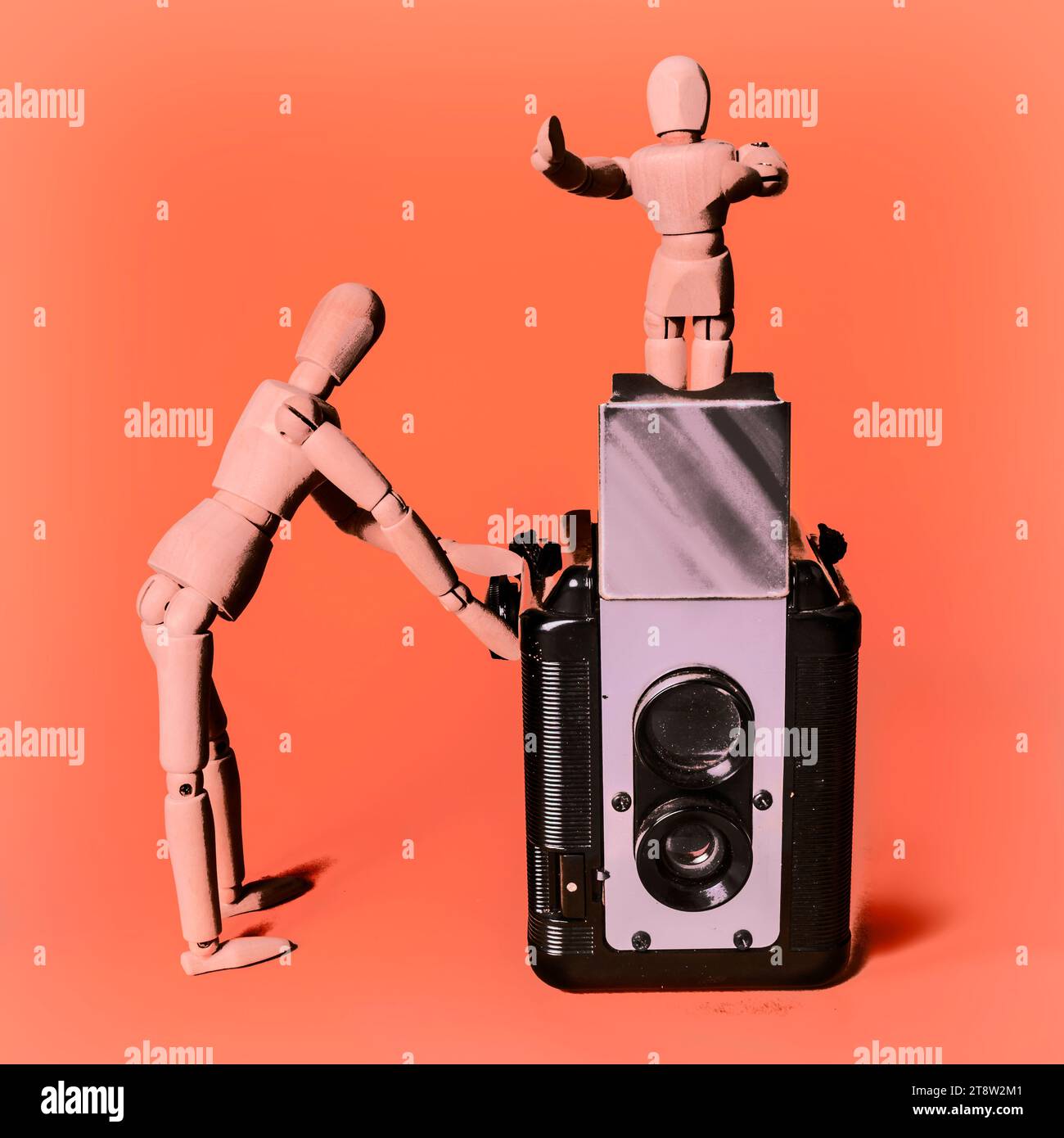 Smart art doll turning the crank in vintage photography with good to go ...