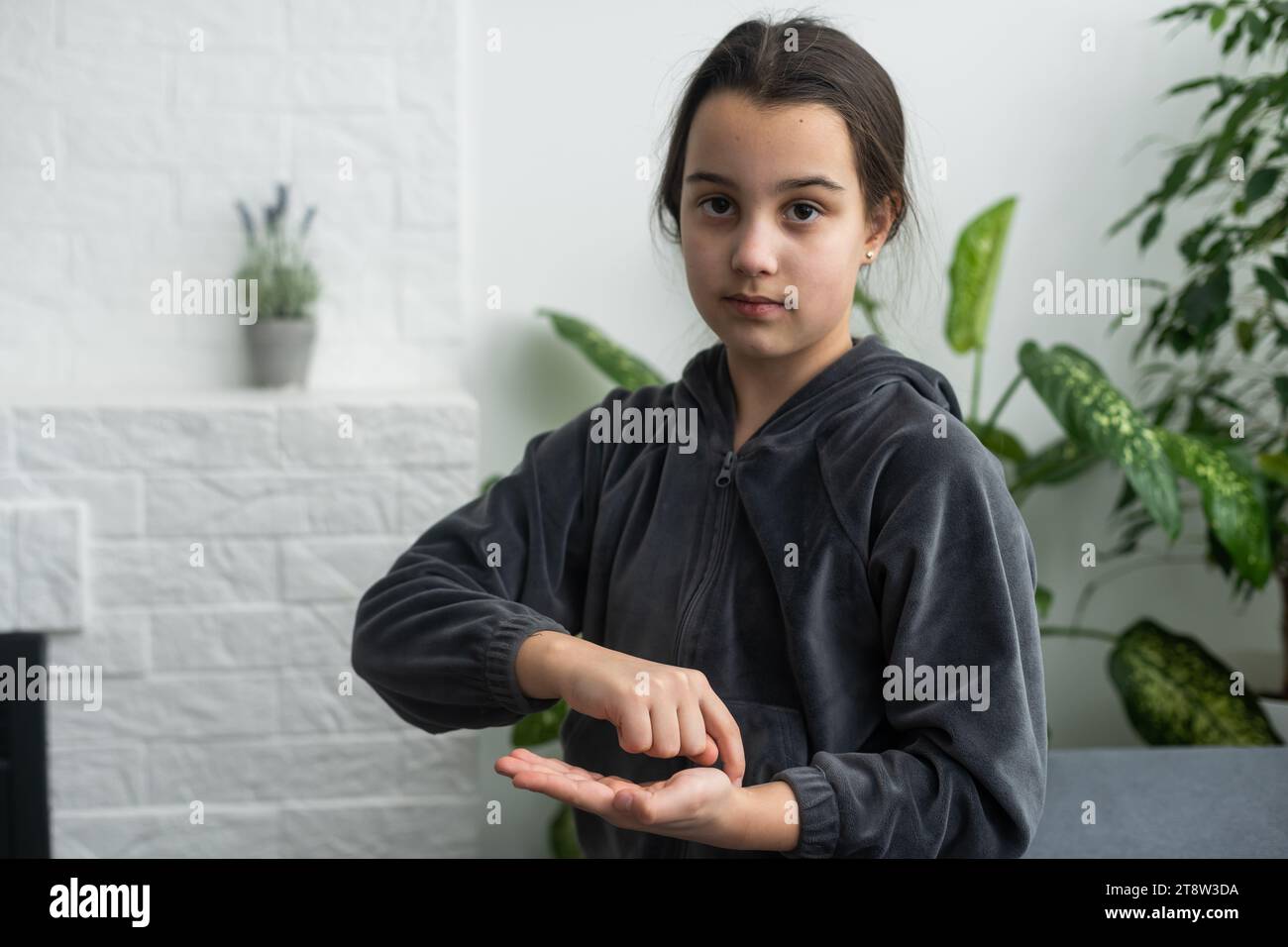 A smiley teenage girl hand sign Stock Photo - Alamy