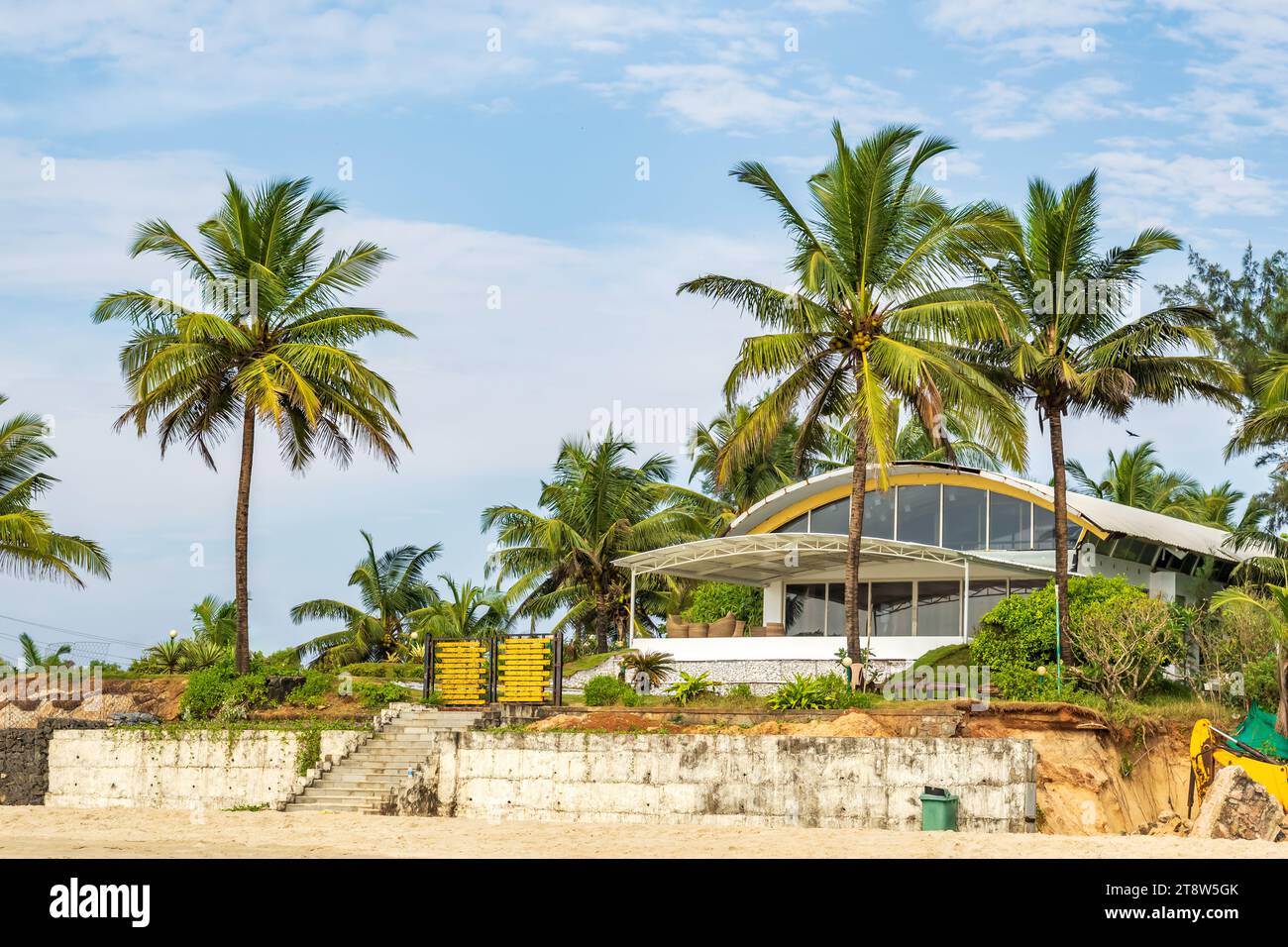 coconut trees on ocean coast near tropical shack or open cafe on beach ...
