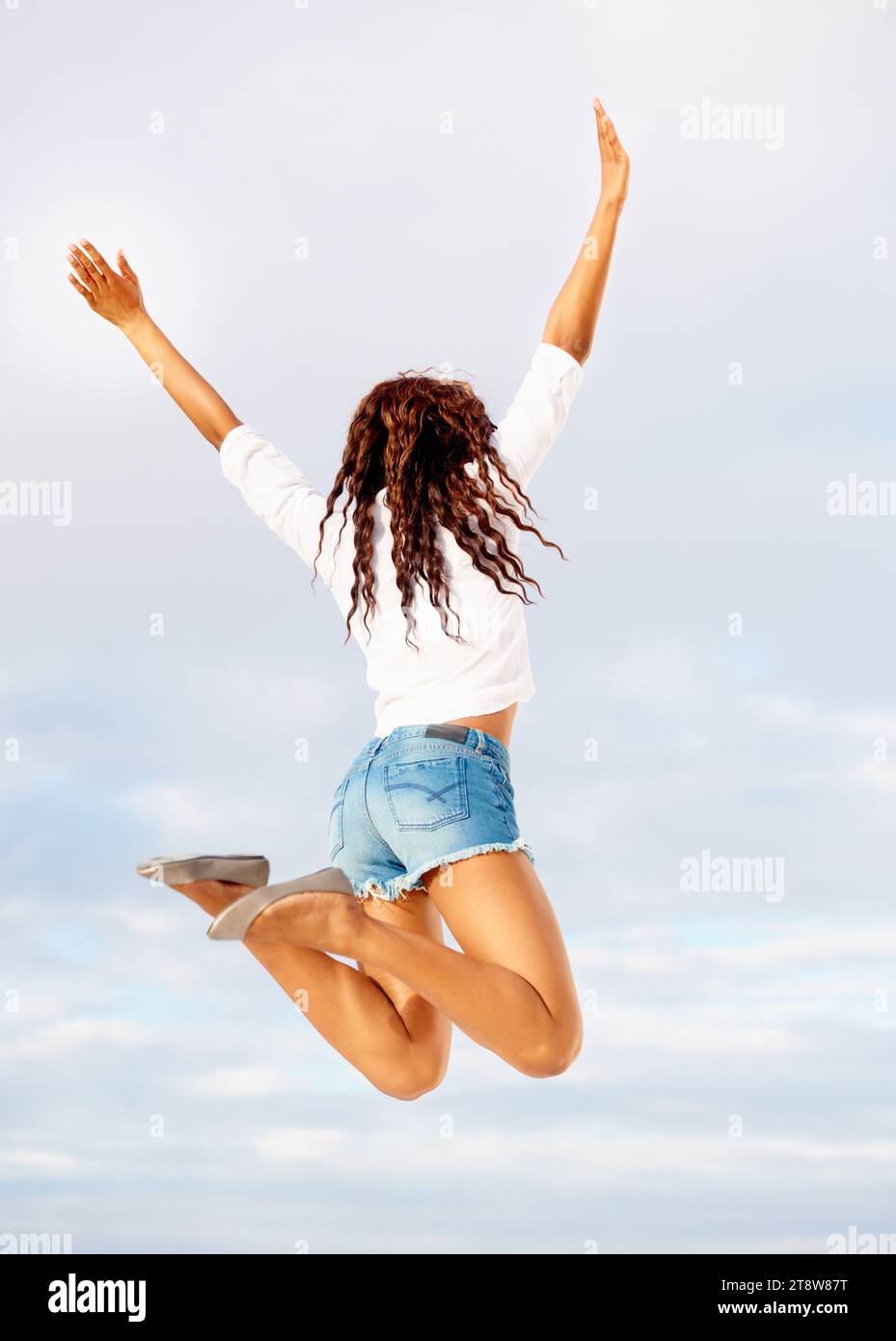 Woman, jumping and in air excited with travel, vacation of winner happy ...
