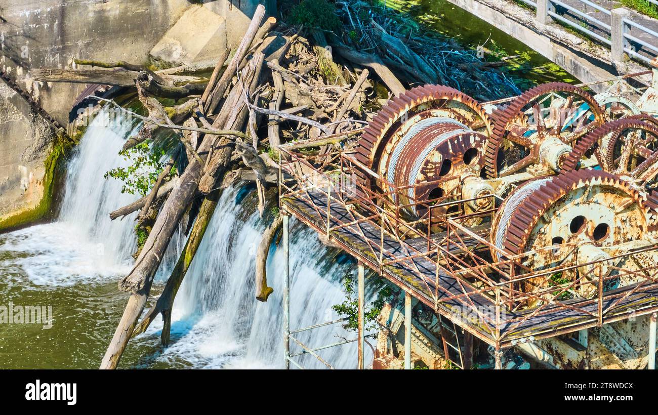 Rusty gears and railing on Maumee River Dam equipment aerial with logs ...