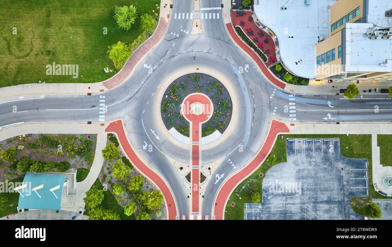 Colorful roundabout road with four exits and hotel in straight down ...