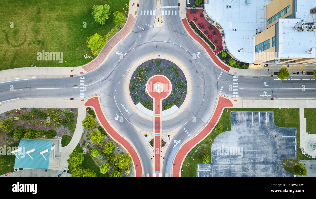 Above aerial roundabout with hotel and Native American statue in center ...