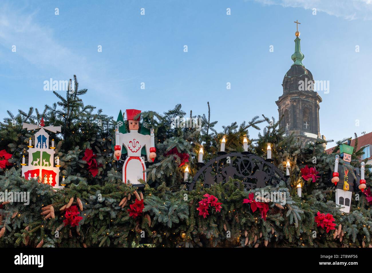 Christmas decorations above market stands at the Striezelmarkt in ...