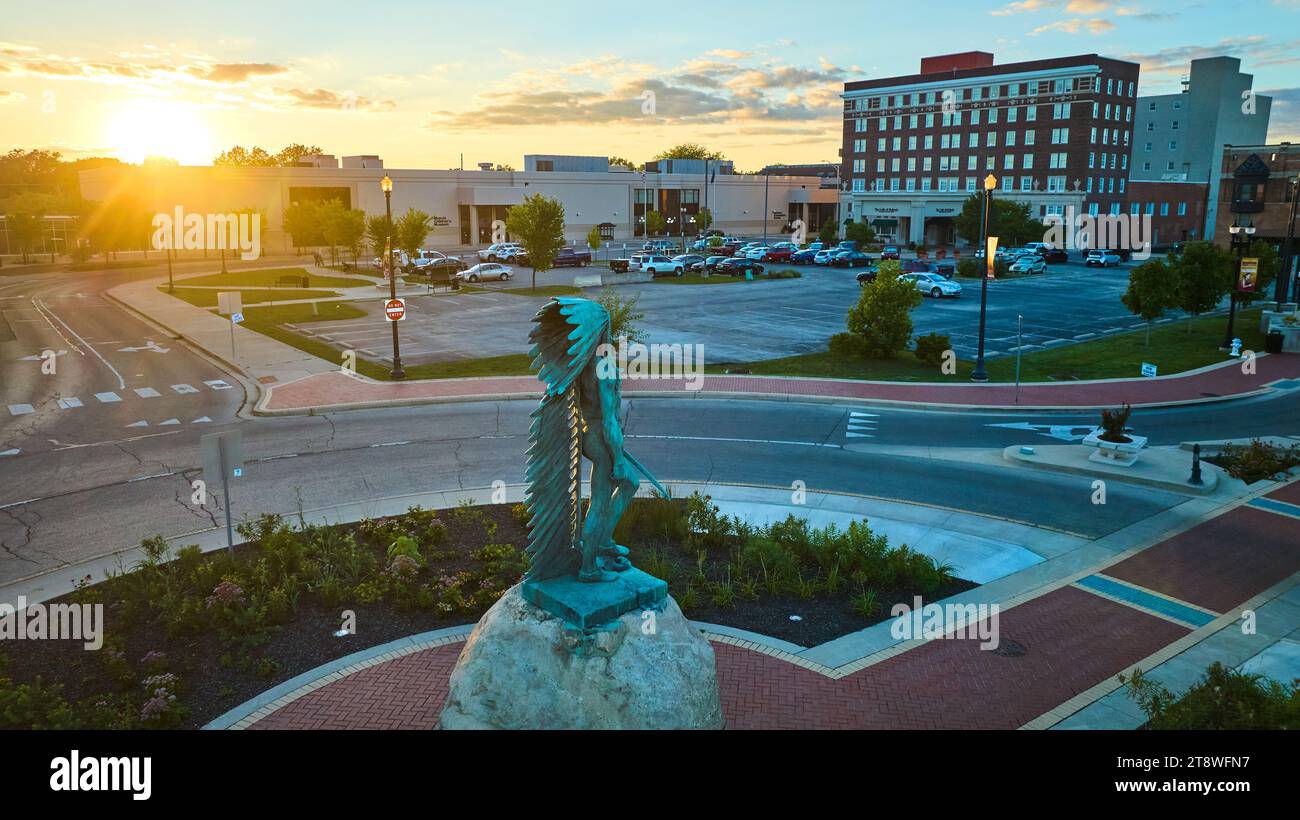 Passing of the Buffalo Native American statue with golden sun beside it ...