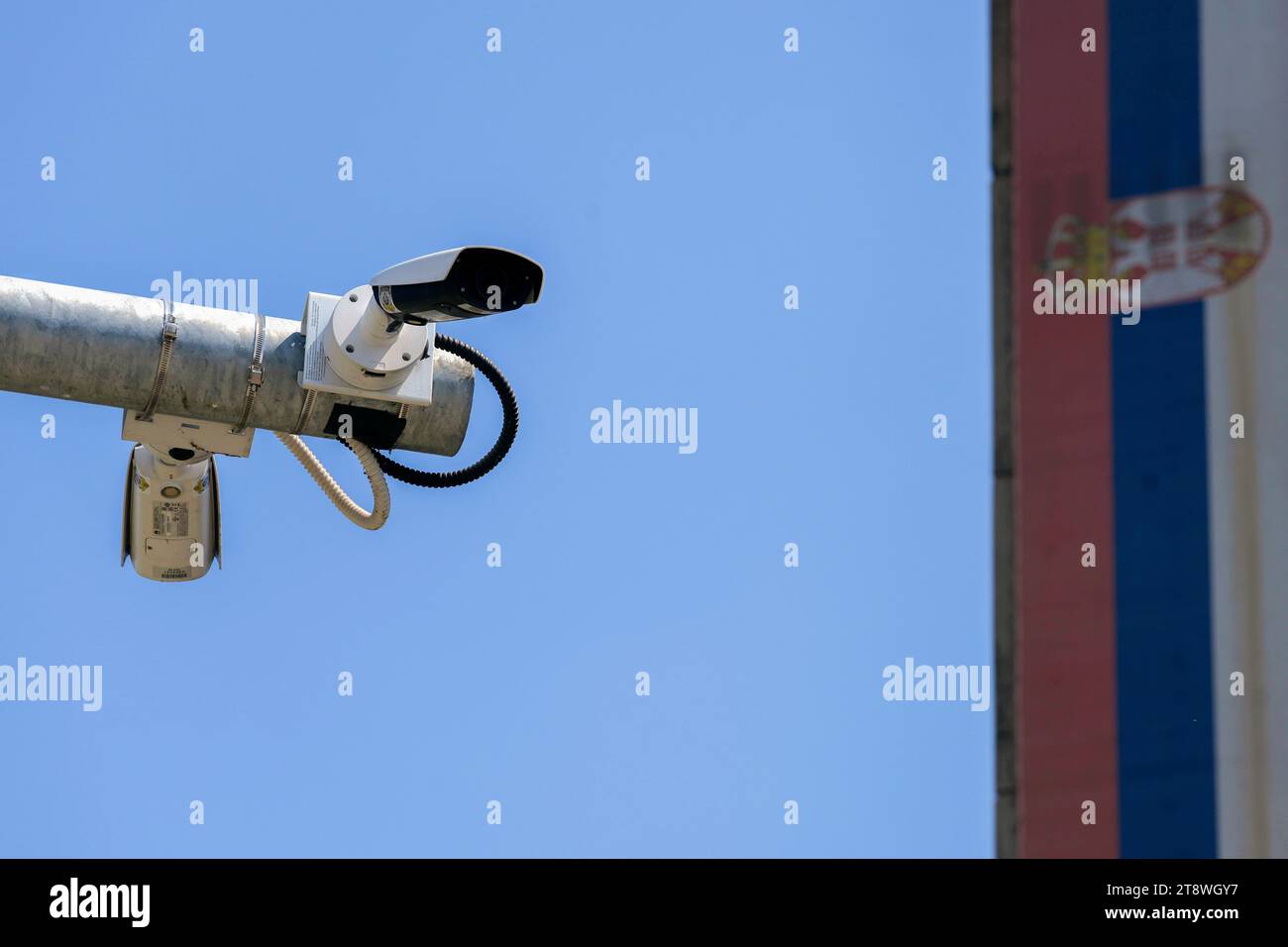 FILE - Security cameras are seen in front of a Serbian flag in Belgrade ...