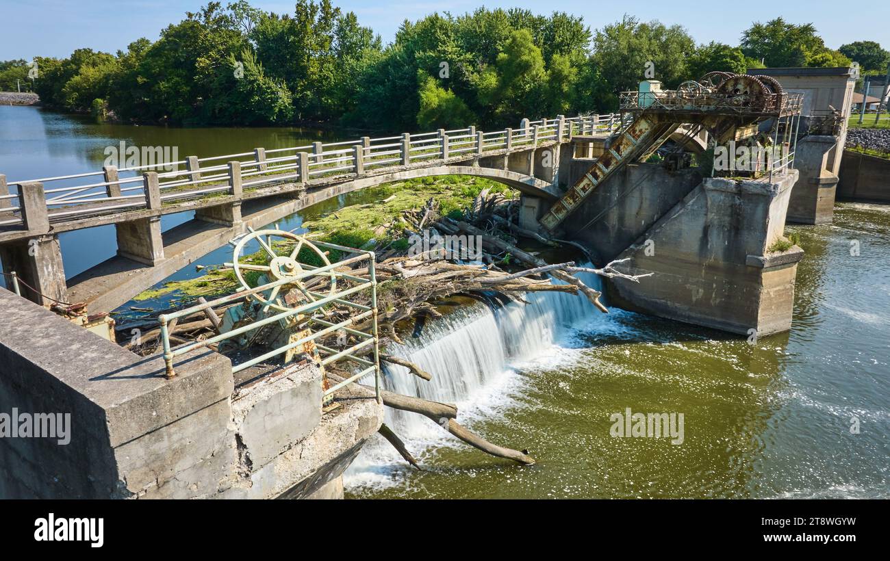 Rusty wheel and cogs on Maumee River Dam equipment beside waterfall ...