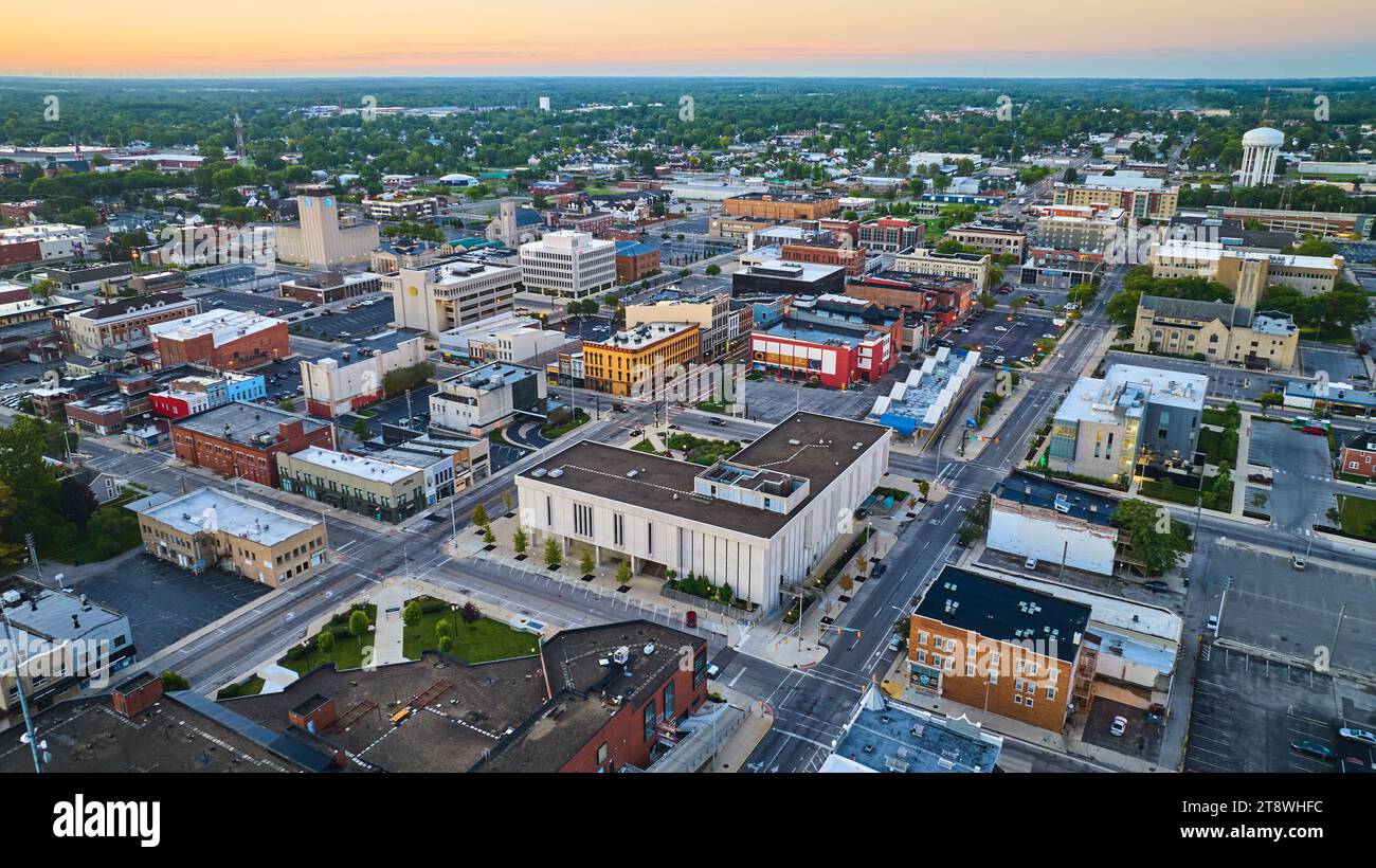 Dawn over Muncie Indiana downtown buildings with courthouse aerial of ...