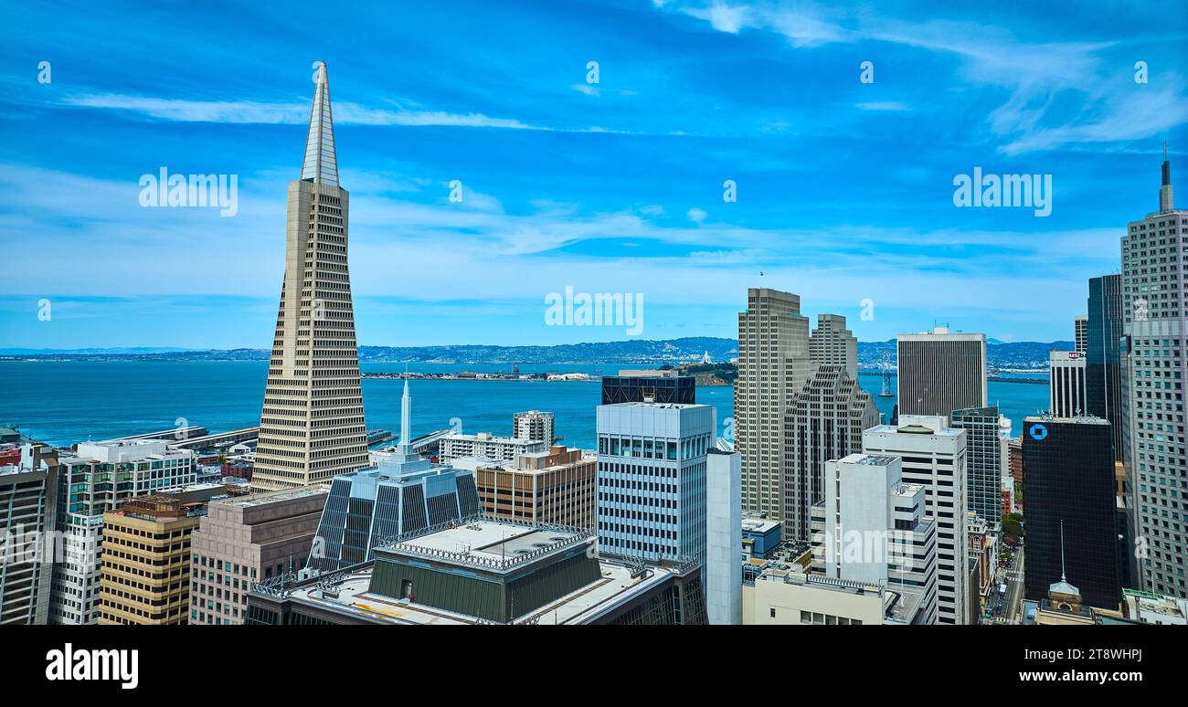 Transamerica Pyramid aerial beside downtown skyscrapers with cloudy ...