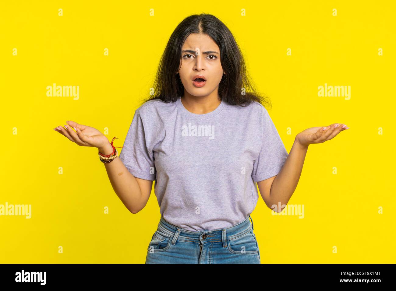 What. Why. Angry Indian woman raising hands in indignant expression ...