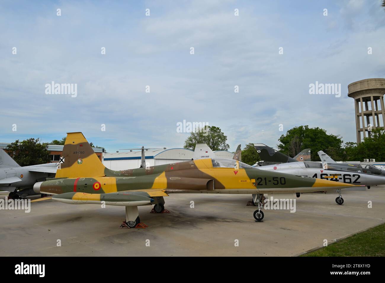 A vintage military jet aircraft in a deteriorated state sitting atop an ...