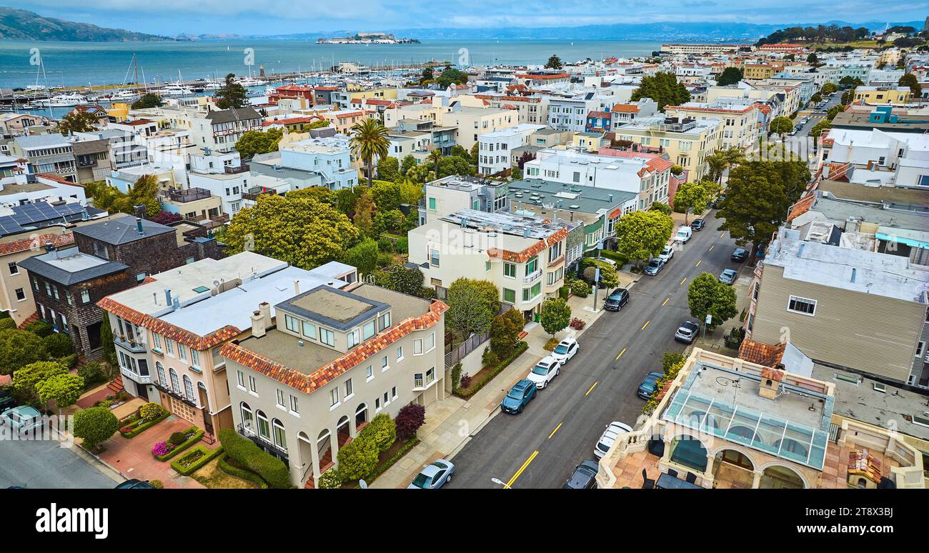 Residential housing and apartments separated by road in aerial San ...