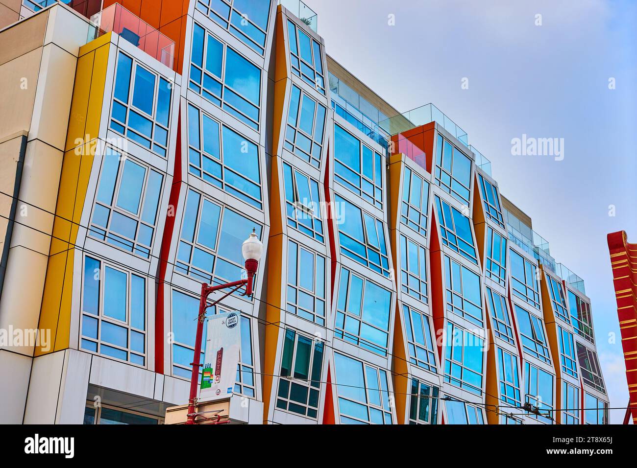Wide view of colorful architecture of tilted blue windows on unique ...