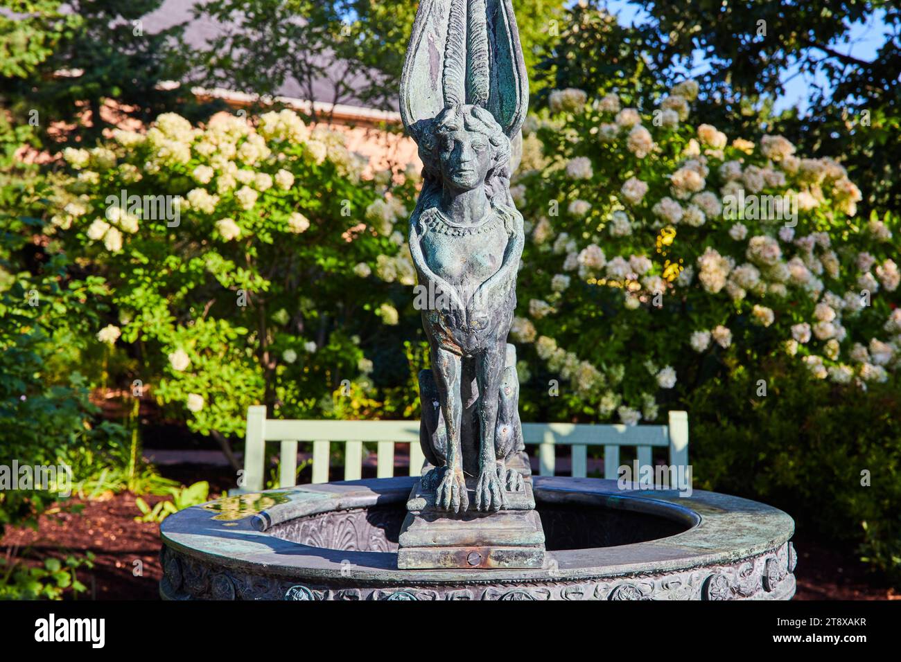 Intelligence of Sphinx in statue in garden on bright summer day ...