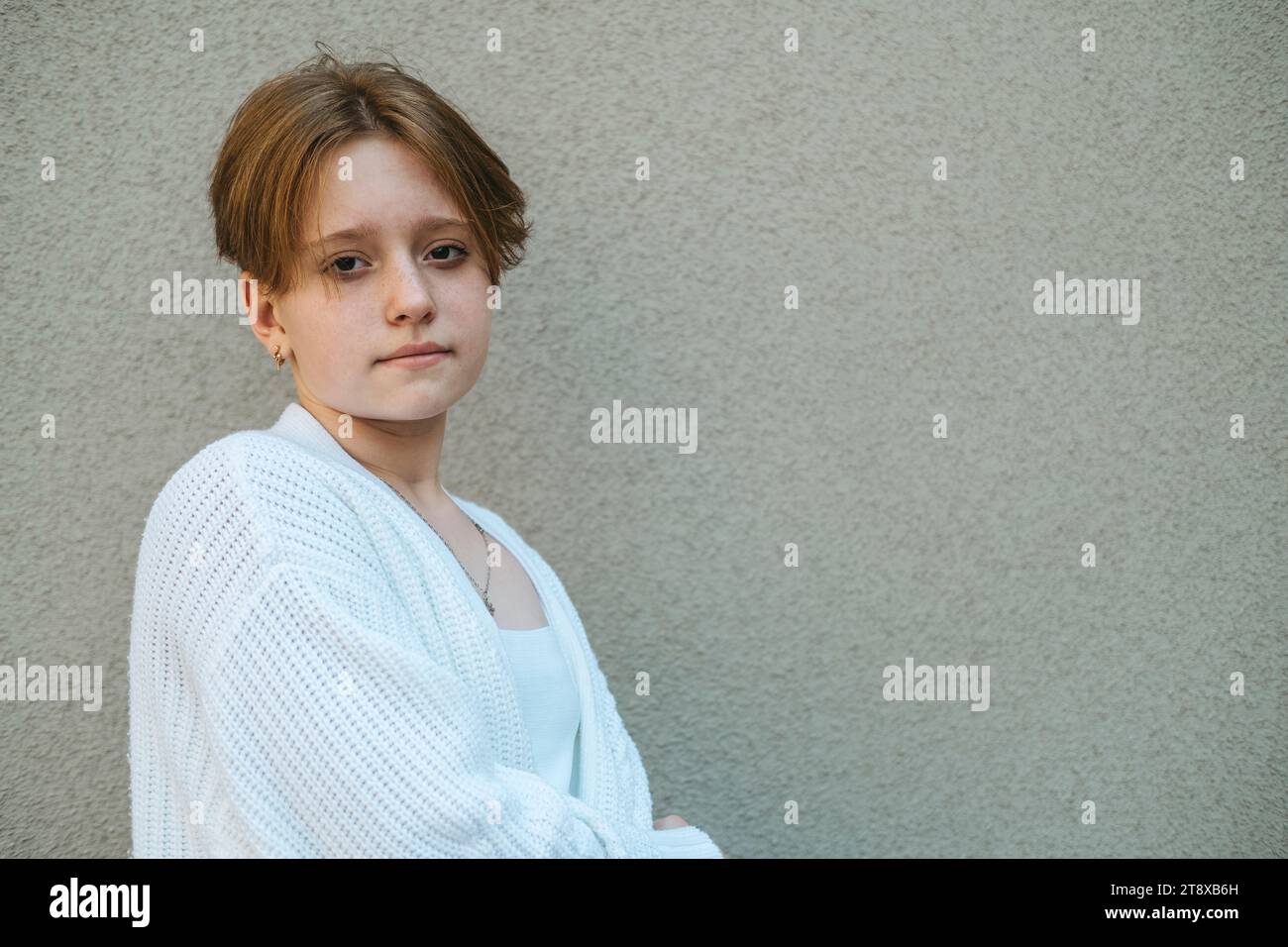 teenage girl short red hair contrasts with serene expression in a ... teenage girl short red hair contrasts with serene expression in a ...