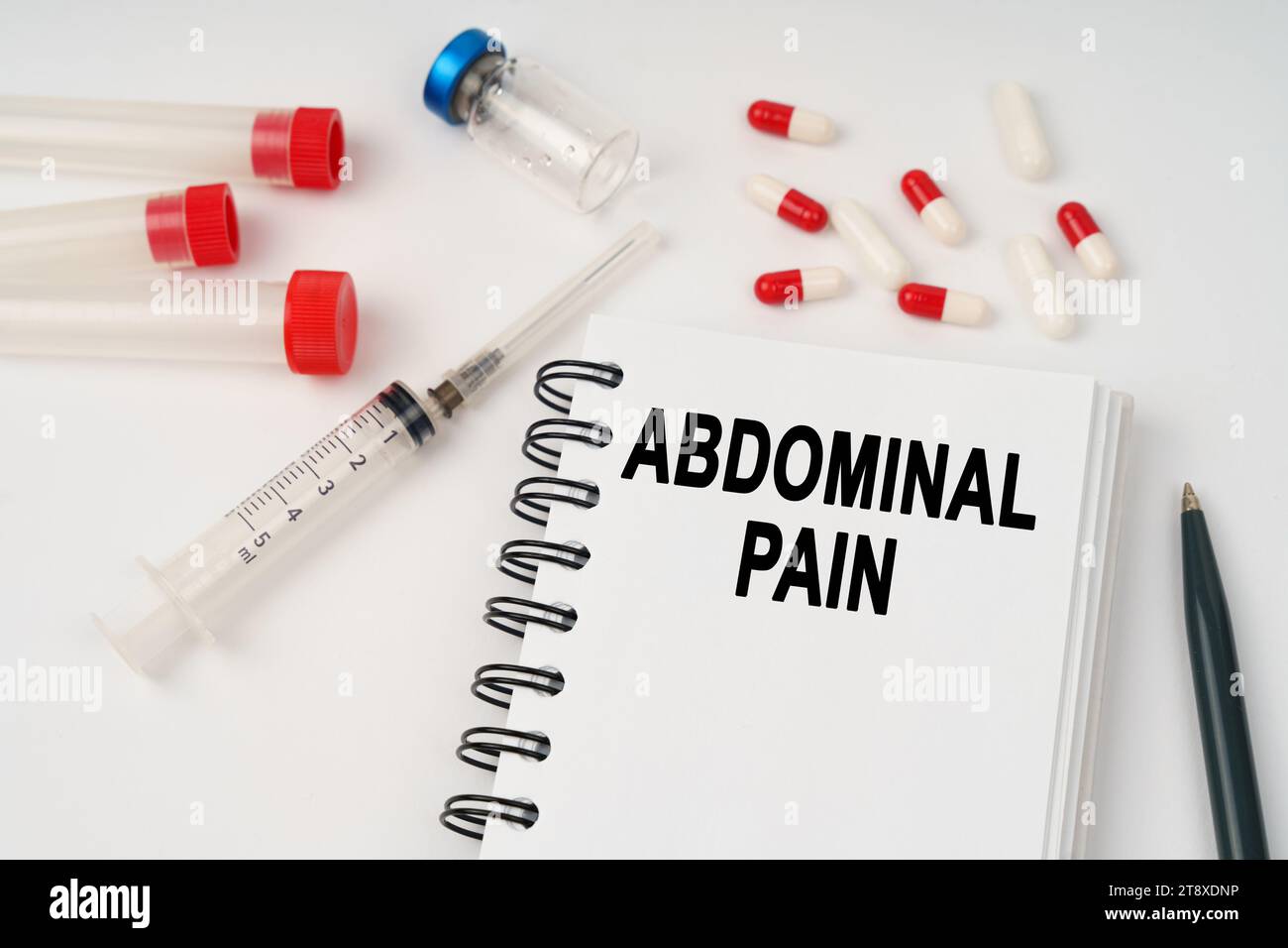 Medical concept. On the table are pills, injections, a syringe and a ...