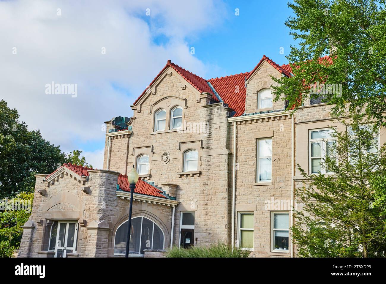 Minnetrista Museum and Gardens mansion building under cloudy blue sky ...