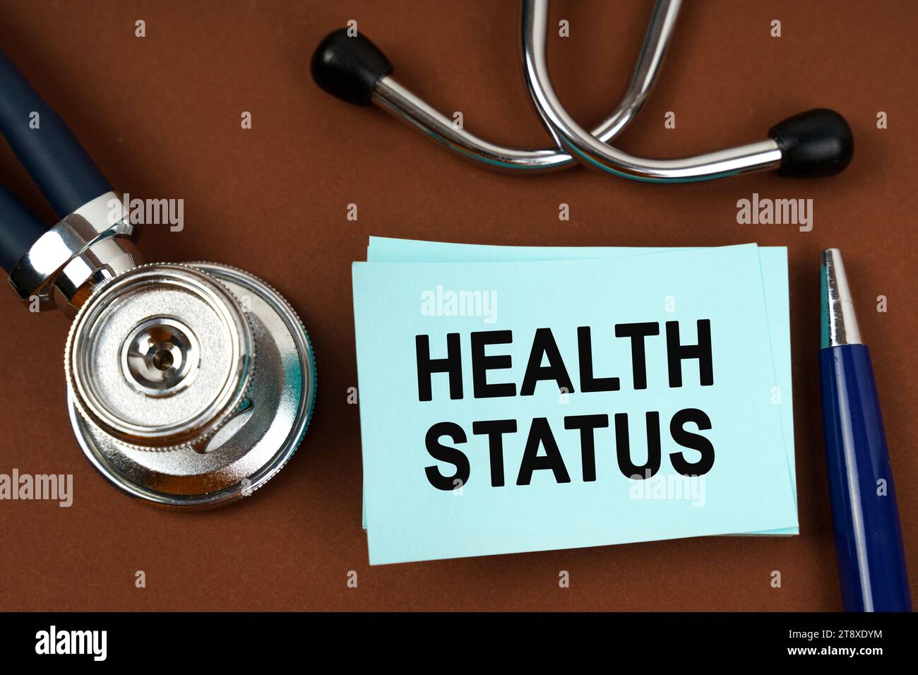 Medical concept. On a brown surface there is a stethoscope, a pen and ...