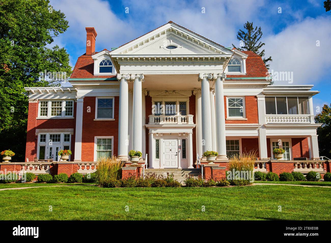 White pillar columns at entrance to building at Minnetrista Museum and ...