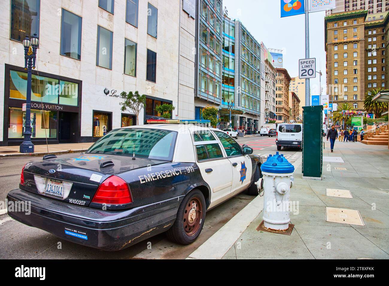 SFPD patrol vehicle beside white and blue fire hydrant on touristy ...