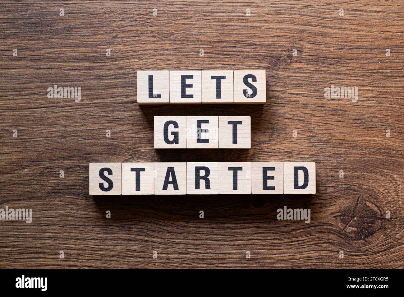 Lets get started - word concept on building blocks, text Stock Photo ...