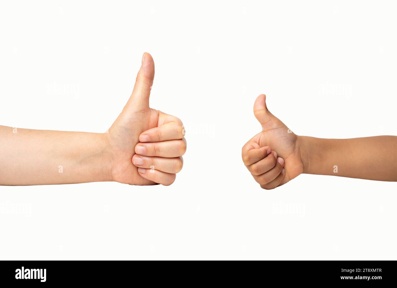 Close up of hand of young girl and kids hand gesture, shows thumbs up ...