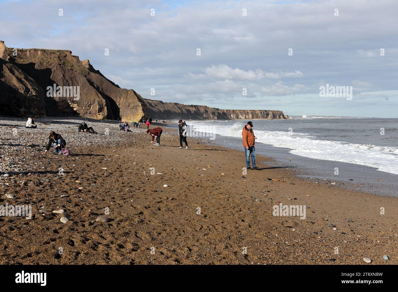 People enjoying a day out searching for and collecting glass on the ...