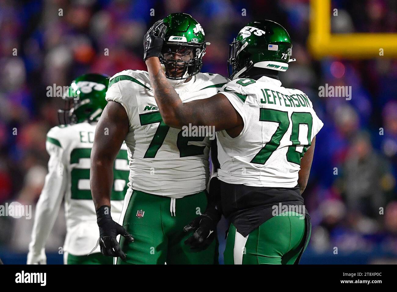 New York Jets defensive lineman Micheal Clemons, left, talks with ...