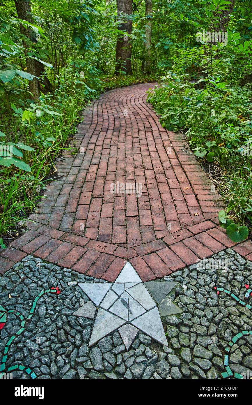 Octagram, eight pointed star pattern in gravel with painted rocks and ...