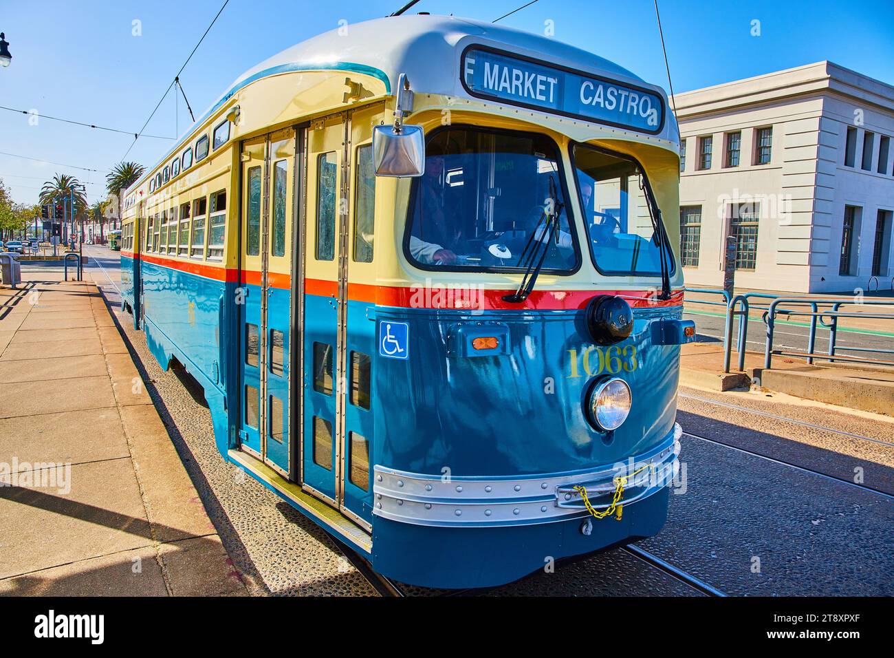 Front and side view blue Castro streetcar at pier 29 on sunny day with ...