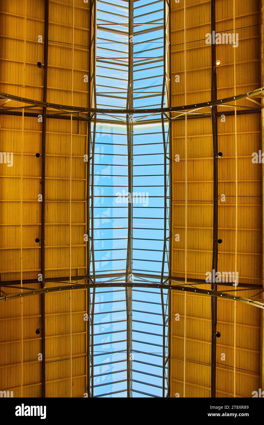 Yellow ceiling architecture with peaked glass roof with blue sky Stock ...