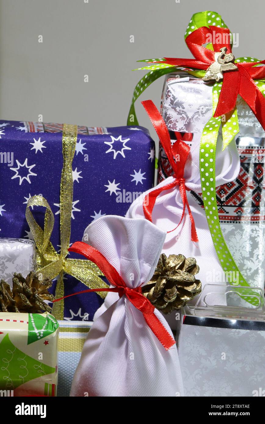 Boxes and cases with gifts in festive packaging with multi-colored ...